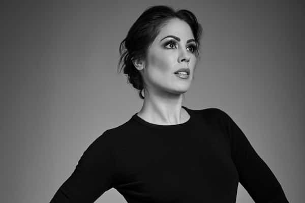 Download Michelle Borth striking a pose in a stylish ensemble Wallpaper ...