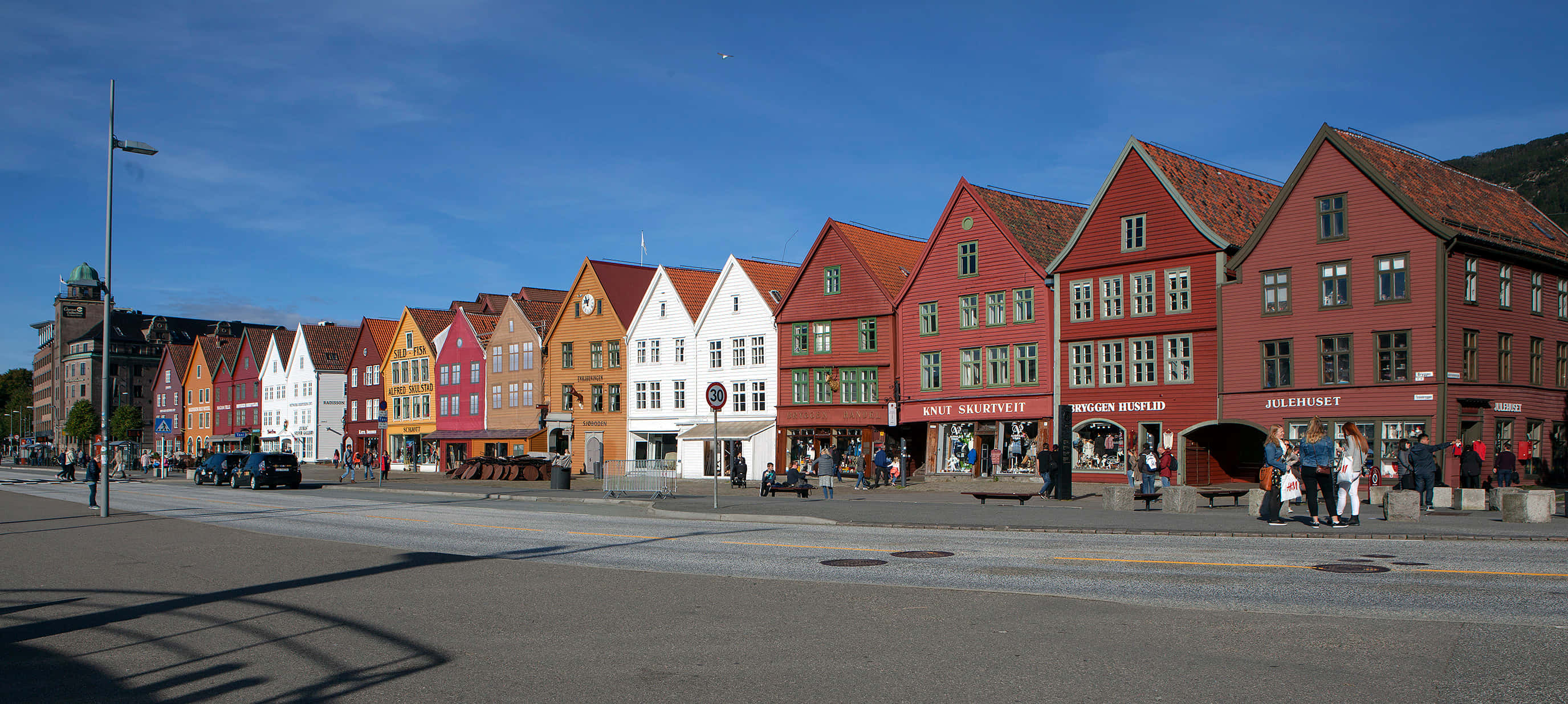 Download Majestic View of Historic Bryggen in Bergen, Norway Wallpaper | Wallpapers.com