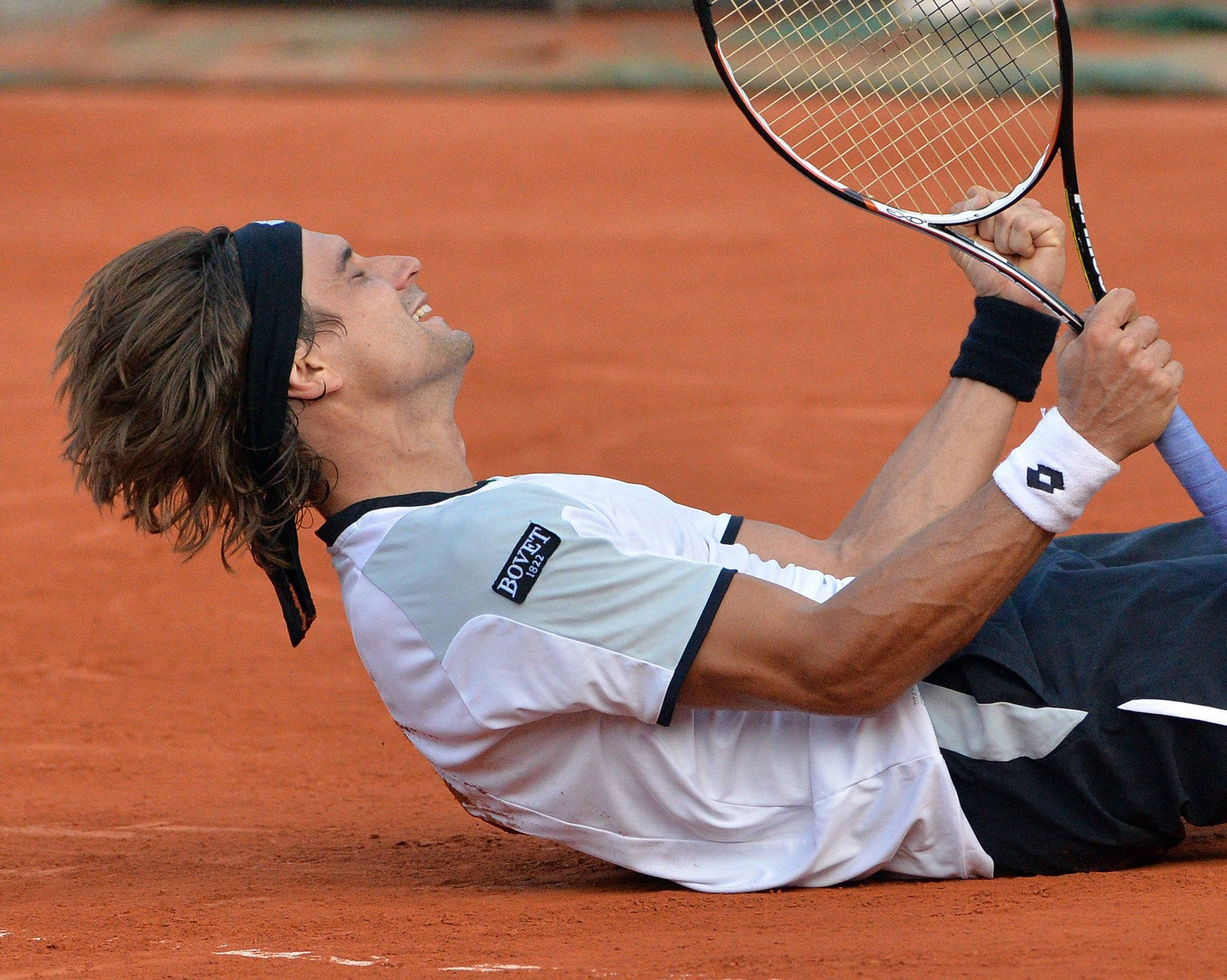 Download David Ferrer Lying On Court Wallpaper | Wallpapers.com