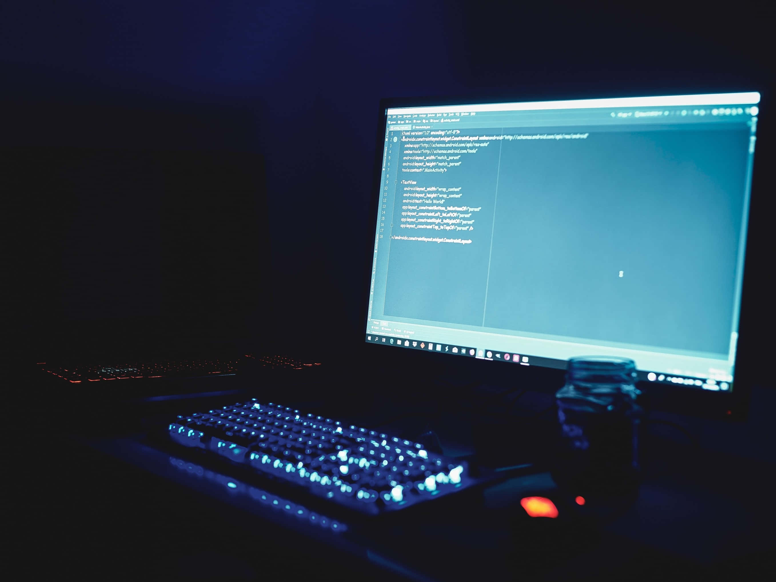 Download A Computer Screen Is On A Desk Wallpaper | Wallpapers.com