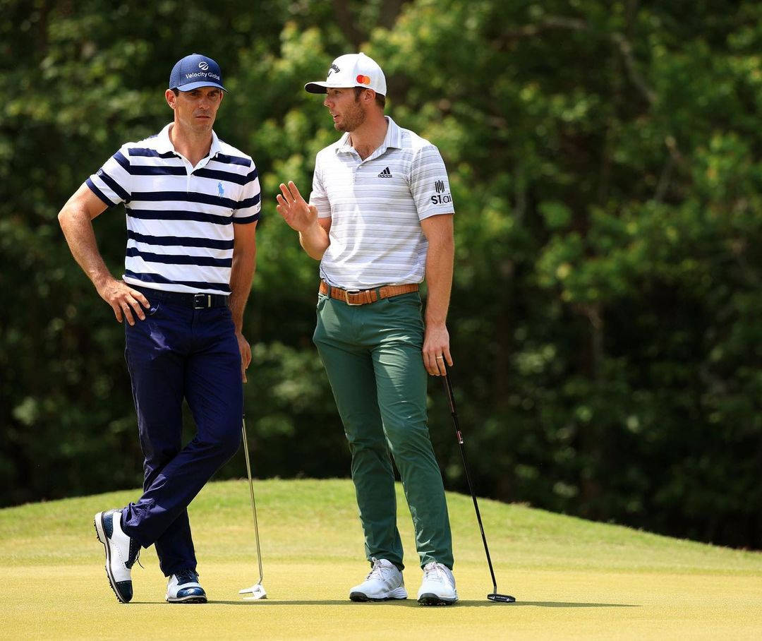 Download Sam Burns Talking With Billy Horschel Wallpaper | Wallpapers.com