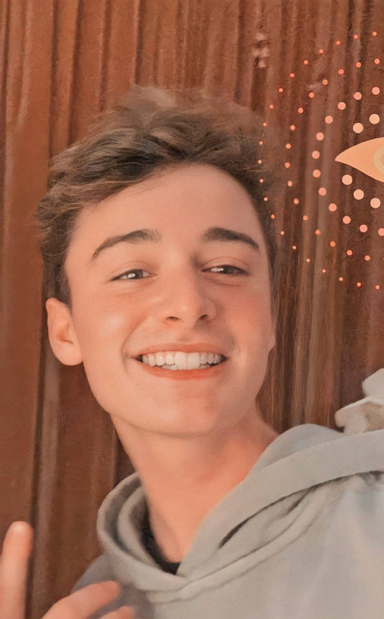 Download Noah Schnapp Selfie Wearing Gray Hoodie Wallpaper | Wallpapers.com